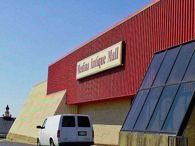 The unassuming red-trimmed exterior of Medina Antique Mall—like finding a treasure chest disguised as a regular building.