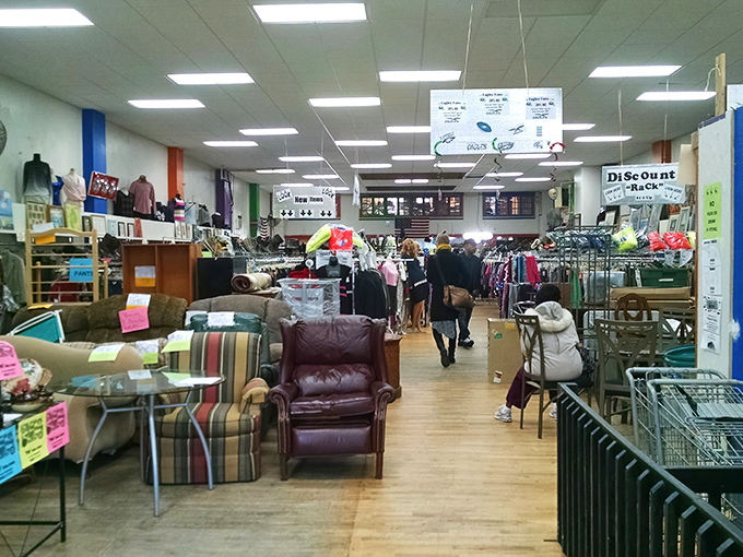 The treasure hunter's paradise unfolds before you – racks of clothing, furniture islands, and endless possibilities await in this Philadelphia secondhand wonderland.