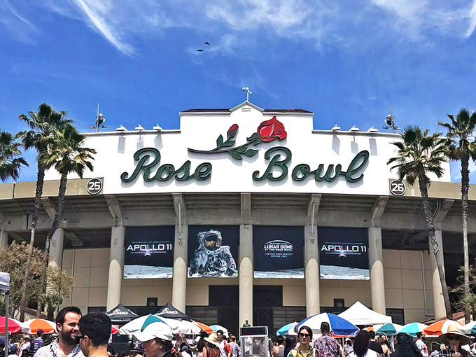 The iconic Rose Bowl sign welcomes treasure hunters to what might be the holy grail of flea markets. Those palm trees aren't just for show—they're witnesses to decades of haggling.