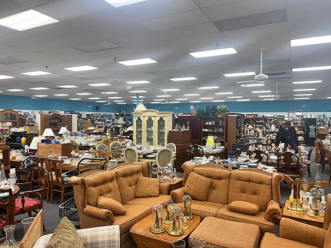 A treasure hunter's dream landscape—furniture islands stretching to the horizon under fluorescent skies. This is where sofas come to find their second chapter.