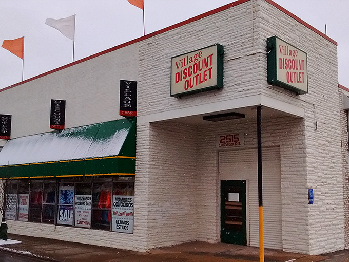The unassuming white brick facade of Village Discount Outlet hides a treasure trove within. Like finding a $20 bill in last year's winter coat—the excitement is just beginning.