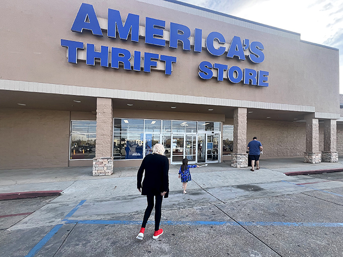 The iconic blue signage of America's Thrift Store beckons bargain hunters like a retail lighthouse guiding ships to treasure-filled shores.
