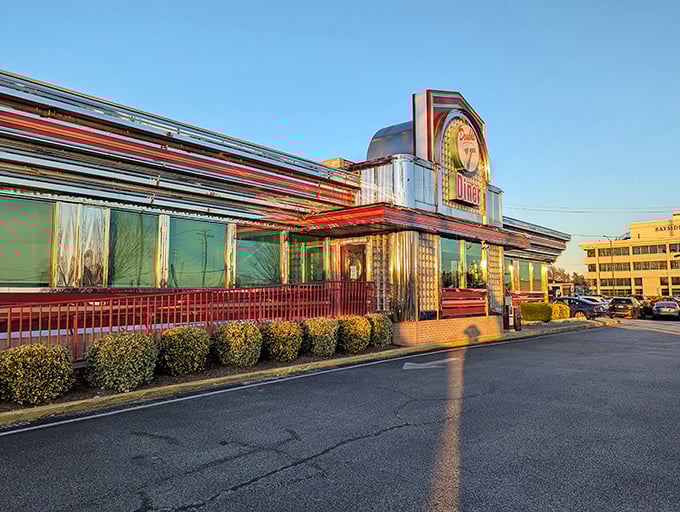 The Double T's neon sign glows like a beacon of comfort food against the twilight sky, promising delicious salvation for hungry travelers.