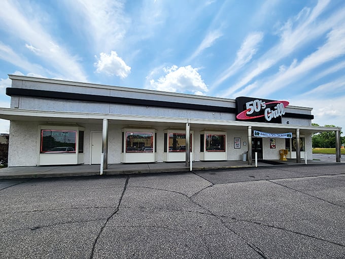 The retro red-and-white sign beckons like a time machine disguised as a restaurant. 50's Grill stands proudly against Minnesota's ever-changing skyline, promising comfort inside.
