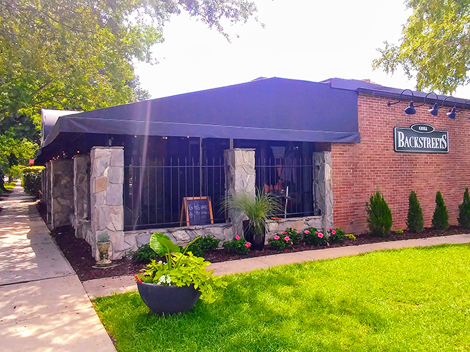 The stone facade of Backstreets Grill welcomes hungry travelers like an old friend who knows exactly what you need after a long day.