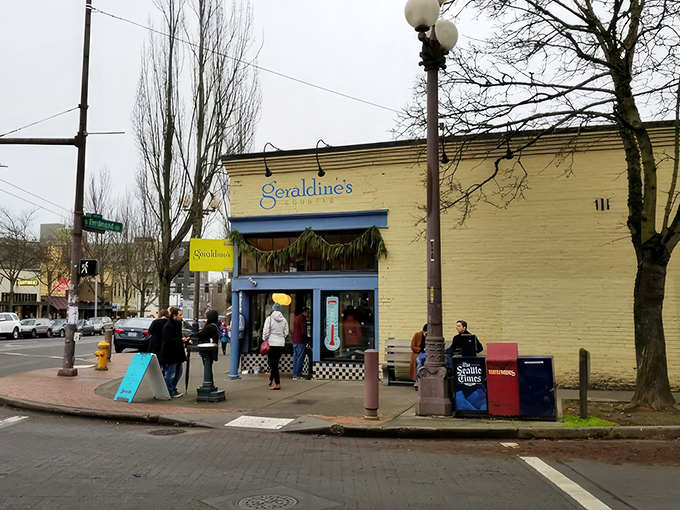 The cheerful blue exterior of Geraldine's Counter brightens up Columbia City's streetscape like a culinary lighthouse guiding hungry travelers home.