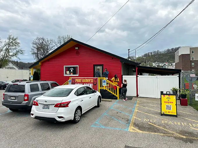 The vibrant red exterior of Phat Daddy's on Da Tracks stands out like a culinary beacon, promising flavor adventures from its humble Charleston hillside perch.