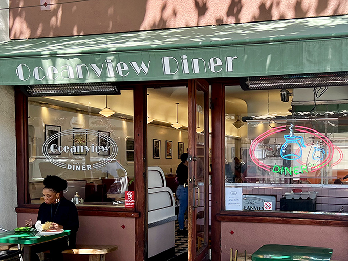 The unassuming green awning of Oceanview Diner beckons like a time portal to simpler days when conversation trumped smartphones and meatloaf reigned supreme.