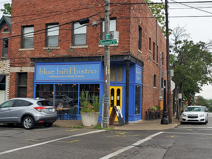 The bright blue storefront with its sunny yellow door stands like a cheerful beacon in Kansas City's Westside neighborhood, promising culinary adventures within.