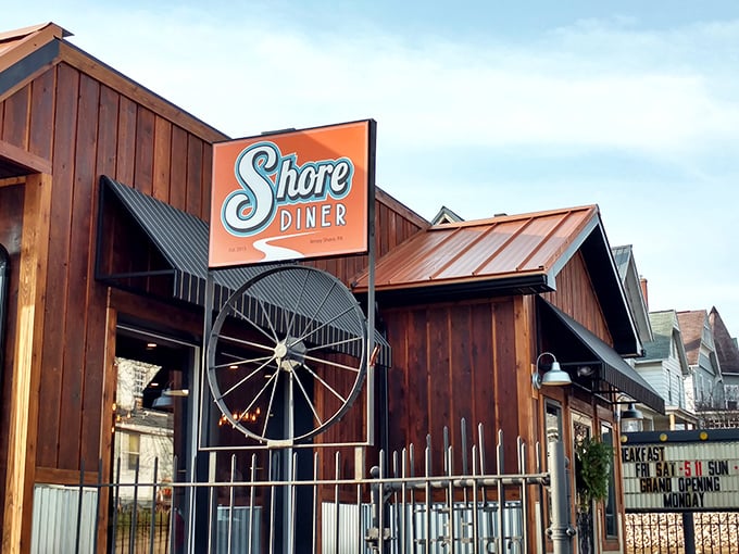 The Shore Diner's rustic wooden exterior and vintage orange sign stand as a beacon of breakfast hope against the Pennsylvania sky. Come hungry, leave happy!