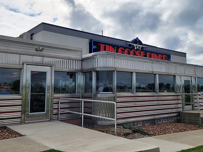 The gleaming stainless steel exterior of Tin Goose Diner shines like a beacon of hope for hungry travelers. This isn't just a restaurant—it's a time machine with pancakes.