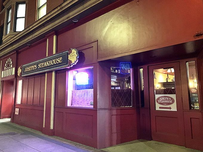 The unassuming brick façade of Joseph's Steakhouse hides culinary greatness like Clark Kent's glasses hide Superman. Classic signage promises old-school excellence.
