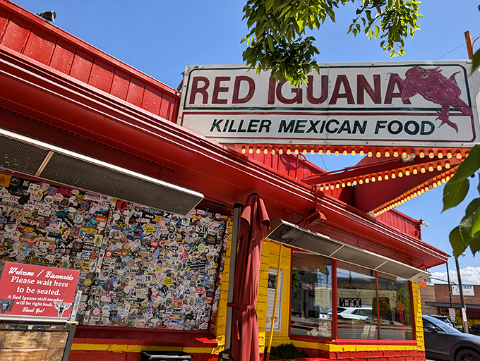 The iconic Red Iguana sign promises "Killer Mexican Food" – a bold claim that's backed up by decades of delicious evidence and perpetual lines of hungry devotees.