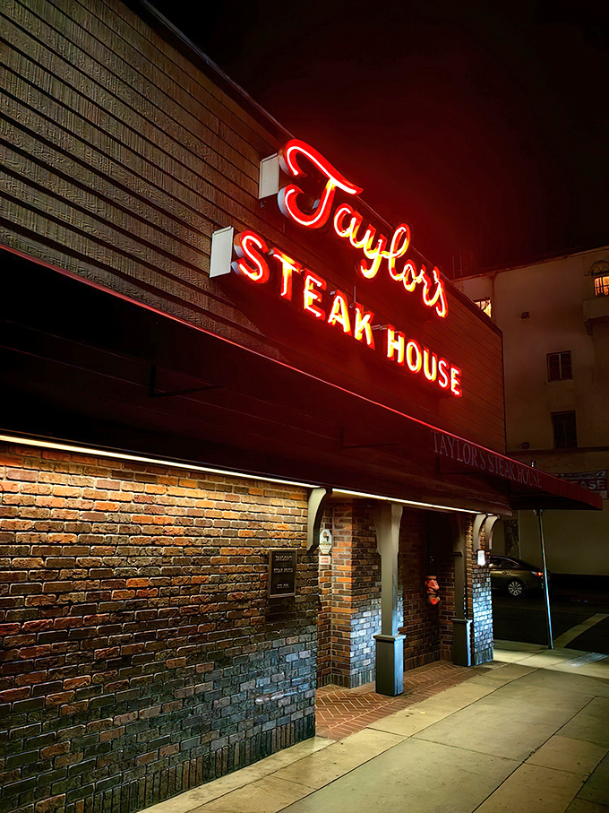 That iconic red neon glow isn't just a sign—it's a beacon for meat lovers across Los Angeles, promising old-school steakhouse perfection within those brick walls.