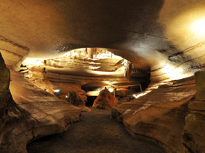 Nature's own cathedral awaits below ground, where light dances across ancient rock formations shaped by millions of years of patient water droplets.