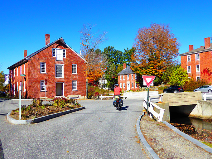 Storybook perfection isn't Photoshopped here—Harrisville's historic buildings embrace the millpond like old friends catching up after a long winter.