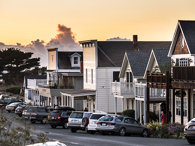 Sunset paints Mendocino's Victorian architecture in golden hues, transforming the coastal town into what looks like the world's most perfect movie set.