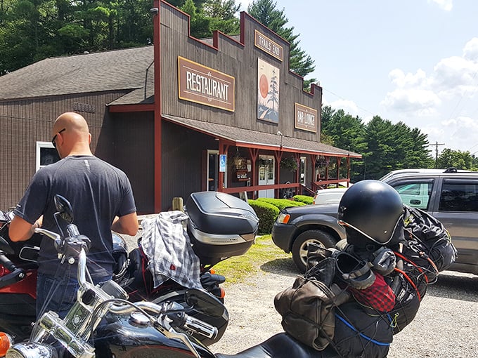 The frontier-style façade of Trail's End Restaurant stands proudly against the Pennsylvania sky, its rustic charm beckoning hungry travelers like a culinary lighthouse in the forest.