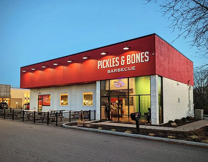 The bright red exterior of Pickles & Bones stands like a beacon of barbecue hope against the Ohio sky. Meat salvation awaits inside.