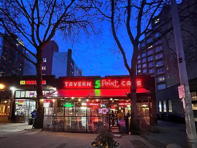 The 5 Point's iconic brick exterior and neon signage beckons like an old friend, promising comfort food and zero pretension in Seattle's bustling Belltown neighborhood.
