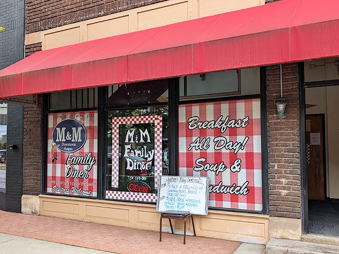 The bright red awning of M & M Family Diner beckons like a culinary lighthouse on Logan's main street, promising comfort and satisfaction within.