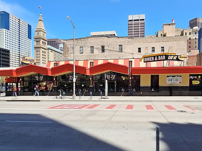 The neon glow of Sam's No. 3 against Denver's skyline isn't just a sign—it's a beacon of culinary comfort calling hungry souls home.