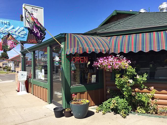 The iconic blue neon sign beckons hungry travelers like a desert oasis. This log cabin diner on Winnemucca's main drag promises comfort food salvation.