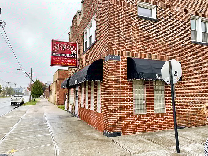 The unassuming brick exterior of Slyman's hides Cleveland's sandwich temple within. Like finding a treasure map in your attic—unremarkable until you realize what's inside.
