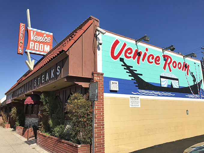 The Venice Room's iconic turquoise and red exterior stands as a defiant time capsule in Monterey Park, beckoning carnivores with its straightforward promise: COCKTAILS and STEAKS.