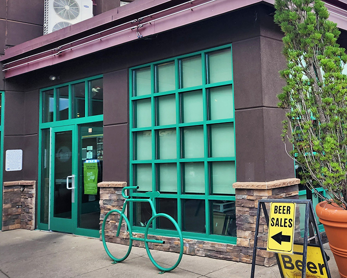 The unassuming exterior of Otto's, with its teal-framed windows and bicycle rack, proves that culinary treasures often hide in plain sight.