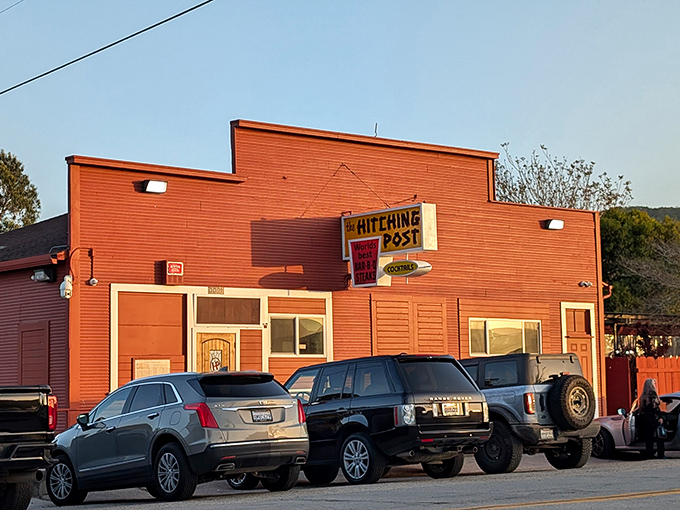 The red exterior of The Hitching Post stands like a culinary lighthouse in Casmalia, beckoning hungry travelers with promises of smoky perfection.