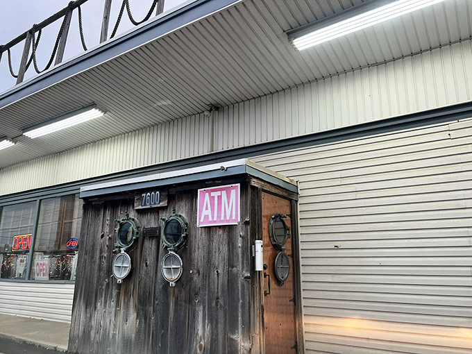 The nautical entrance to Under the Pier looks like a movie set—wooden posts, rope barriers, and a vibrant hand-painted sign that practically shouts "fresh seafood inside!"