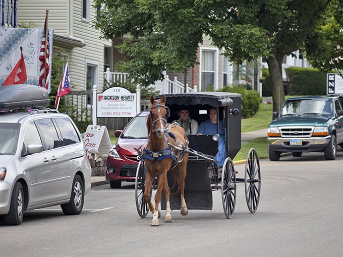 Where modern meets tradition: Amish buggies sharing the road with cars in Sugarcreek, a daily reminder that some of life's best journeys happen at horse-speed.