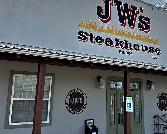 The unassuming exterior of J W's Steakhouse promises little but delivers everything—like finding a diamond in a haystack that happens to serve perfect steaks.