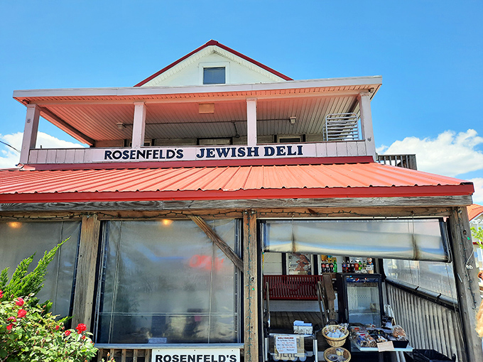 The red-roofed charm of Rosenfeld's exterior promises no-frills authenticity—a delicatessen oasis amid Rehoboth's beach-themed eateries.