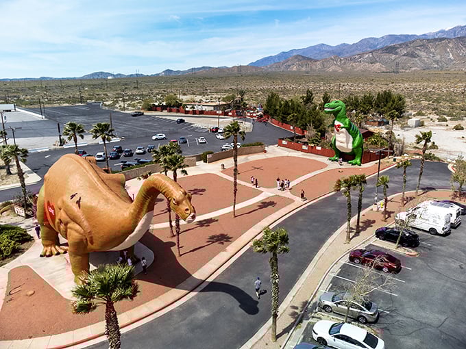 The ultimate desert mirage! Dinny the Apatosaurus and Mr. Rex stand guard over Interstate 10, welcoming weary travelers to their prehistoric playground.