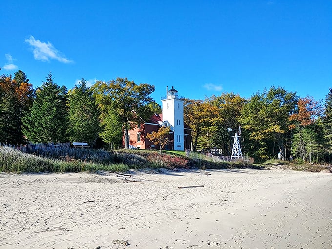 The classic red brick and white tower combination makes 40 Mile Point Lighthouse look like it belongs on a postcard or perhaps your next holiday card.