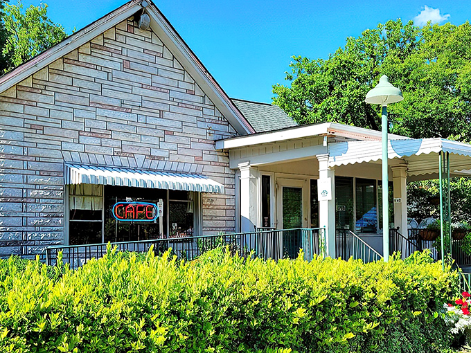 The humble stone facade of Loveless Cafe stands like a time capsule of Southern hospitality, promising comfort food treasures within its welcoming porch.