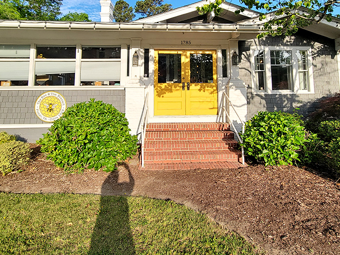 Those sunshine-yellow doors aren't just an entrance—they're a promise of the golden, buttery delights waiting inside this unassuming Pungo treasure.