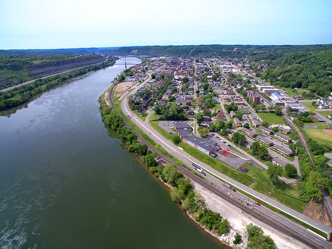 The Ohio River cradles Steubenville like a proud parent, offering waterfront views that would cost a fortune elsewhere but come standard with local living.