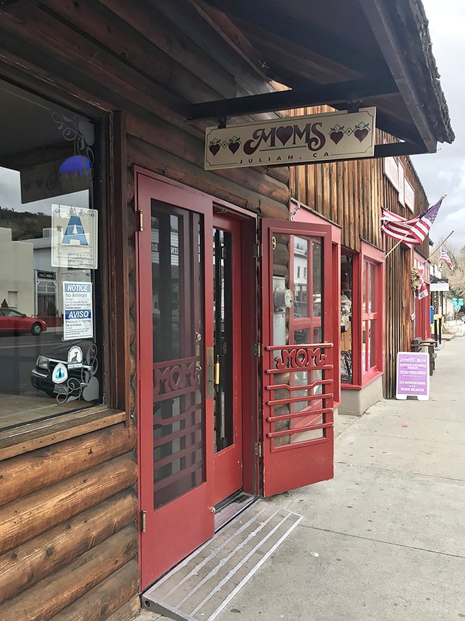 The rustic log cabin exterior with its signature red doors beckons pie lovers like a siren song for the sweet-toothed.
