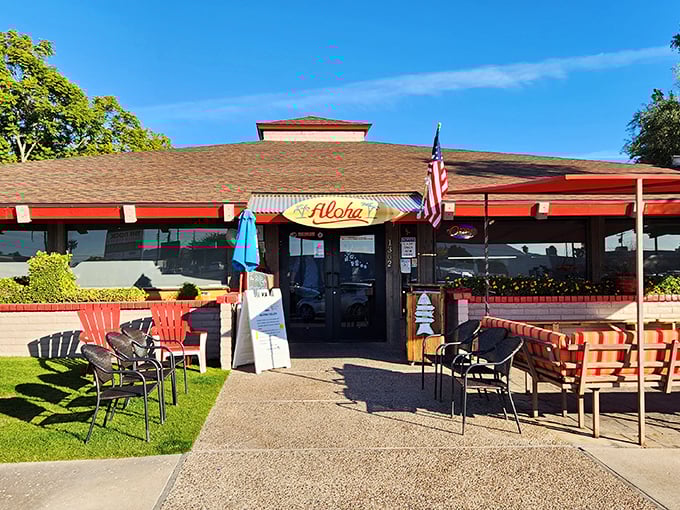 The thatched umbrella and "Aloha" sign promise a tropical escape, while the American flag reminds you this is breakfast patriotism at its finest.