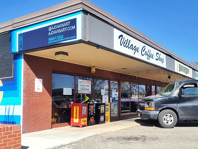 The iconic Village Coffee Shop sign stands proudly against the Colorado blue sky, promising breakfast salvation to hungry Boulder residents.