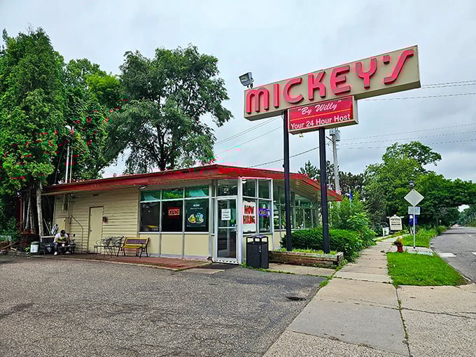 The red-roofed beacon of breakfast hope stands proudly against Minnesota's blue sky, promising comfort food that transcends time.