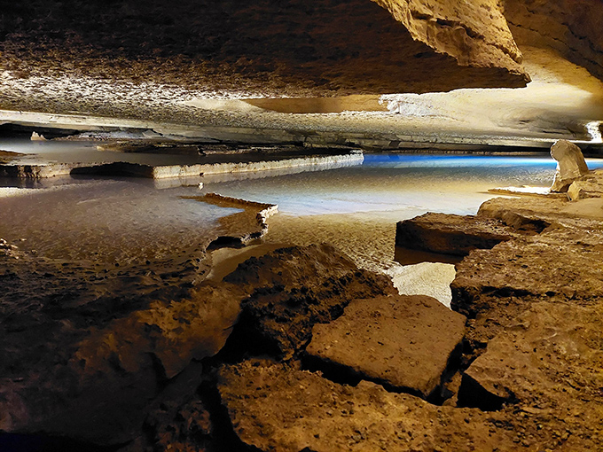 Nature's own cathedral awaits below ground, where light dances across ancient rock formations shaped by millions of years of patient water droplets.