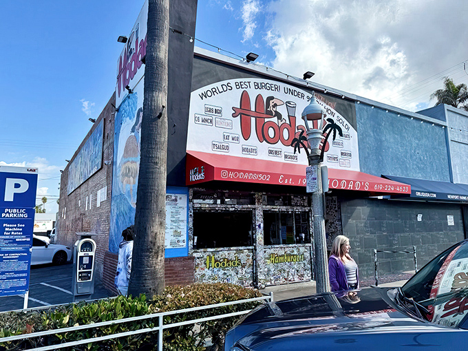 The iconic red awning of Hodad's boldly claims "World's Best Burger!" – a statement that seems less like bragging and more like a public service announcement once you've tasted their food.