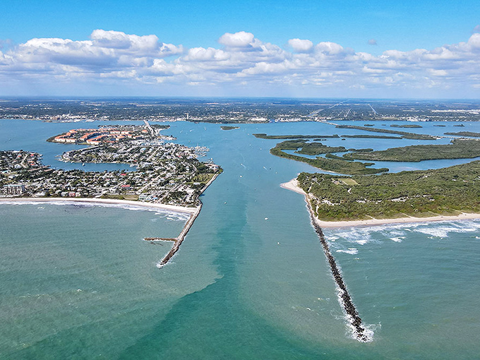 The view from above reveals Fort Pierce's true character – where turquoise waters meet civilization on one side and untamed nature on the other.