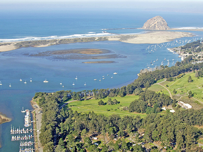 Morro Bay's panoramic splendor unfolds like nature's own IMAX experience, with that iconic rock standing guard over boats dotting the blue harbor.
