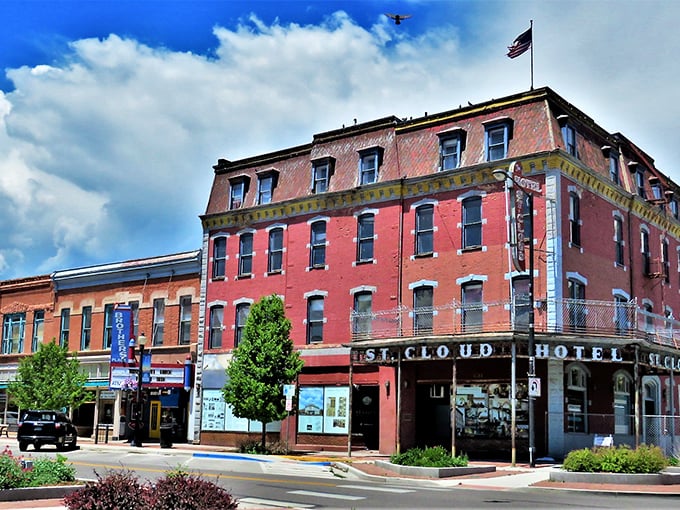 Historic brick buildings line Main Street in Cañon City, where Pizza Madness offers a slice of local flavor amid architecture that whispers tales of Colorado's past.