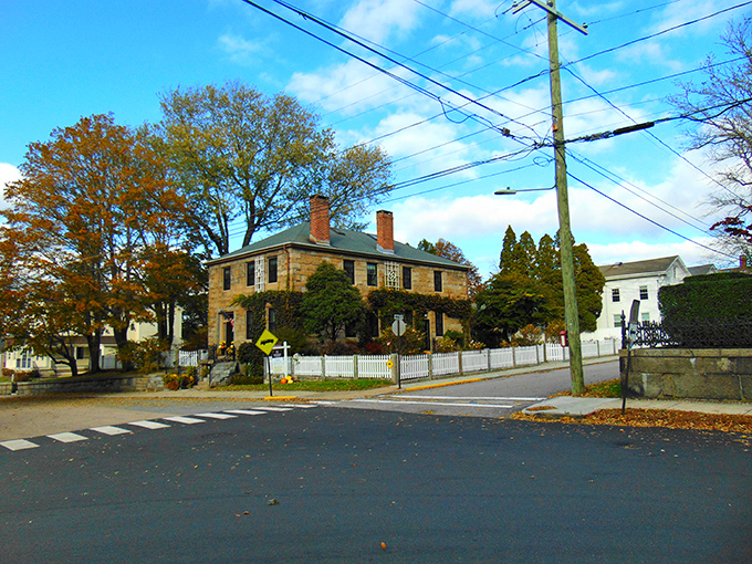 Colorful colonial homes line Stonington's streets like a New England rainbow – red, yellow, and white facades telling stories of maritime heritage.